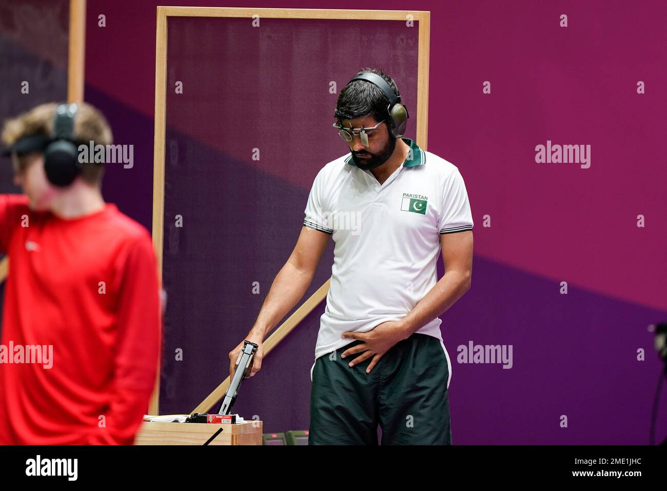 Ghulam Mustafa Bashir, of Pakistan, competes in the men's 25-meter ...