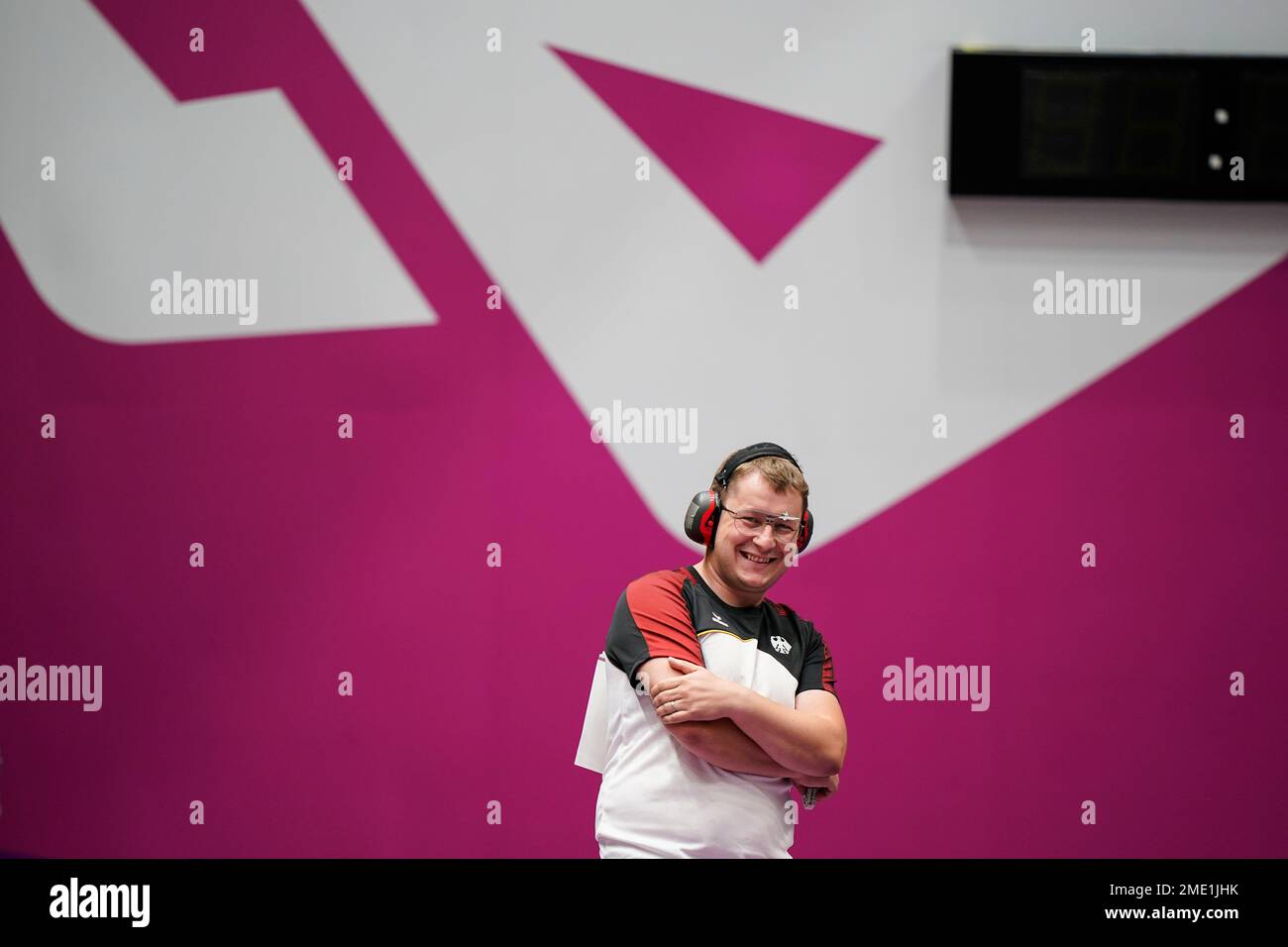 Christian Reitz, of Germany, smiles as he competes in the men's 25 ...