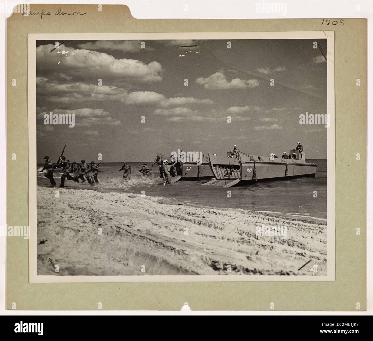 Coast Guard soldiers disembark from invasion barges during training ...