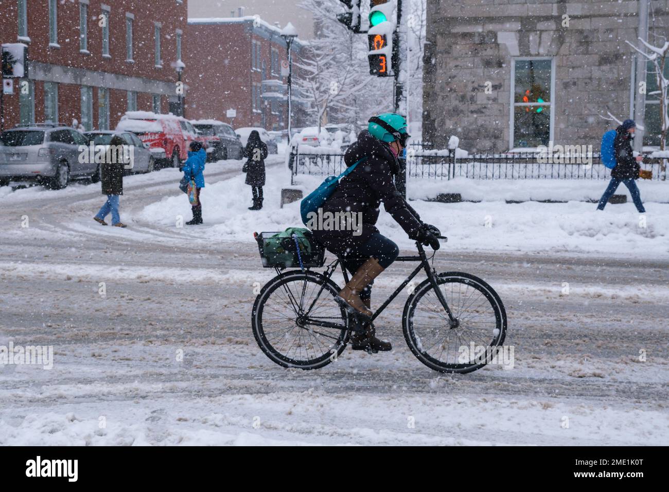 Montreal, CA, 17 December 2022 : Woman riding bike on Mont-Royal Avenue ...