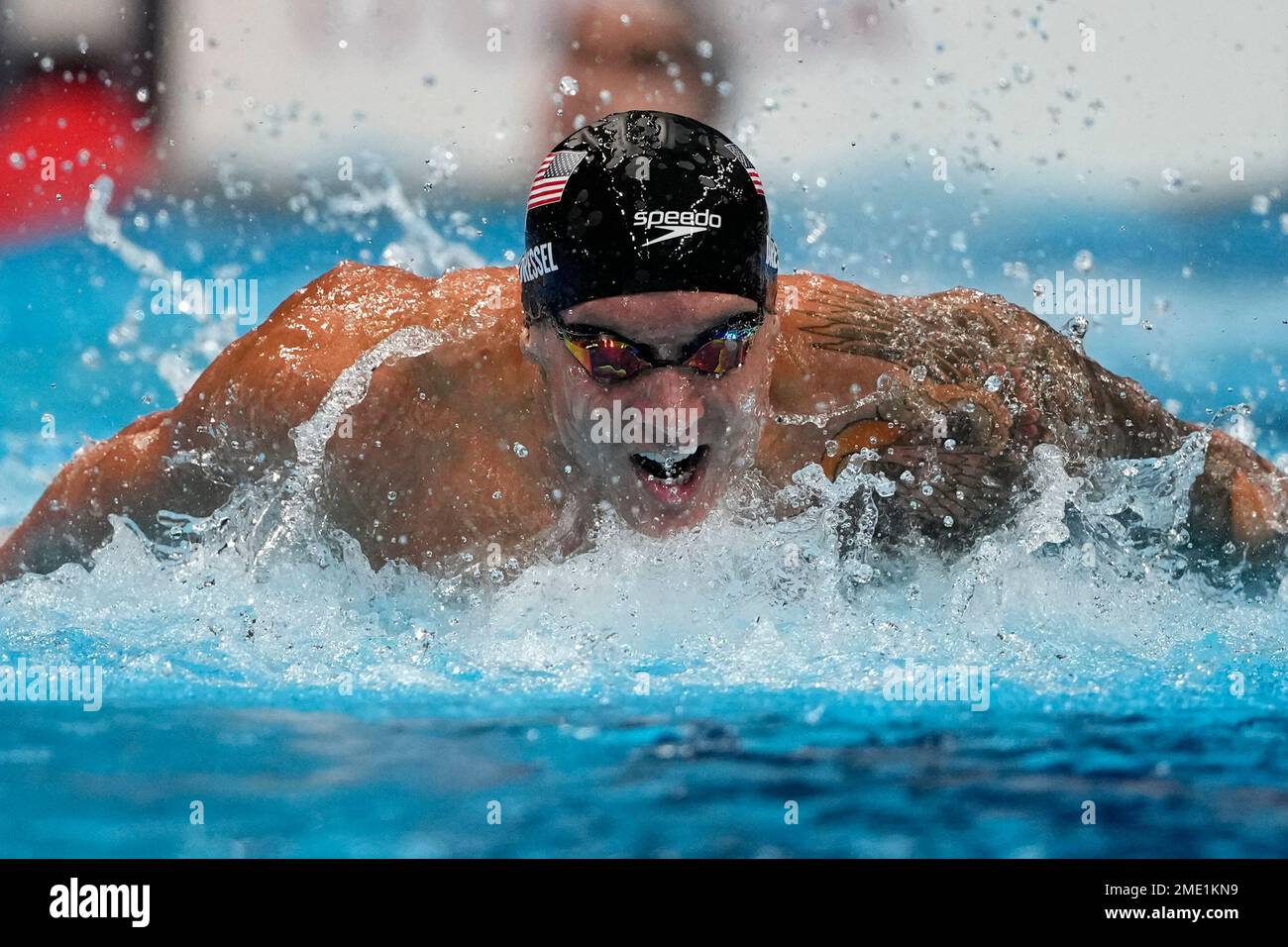 Caeleb Dressel, of the United States, swims in the men's 4x100-meter ...