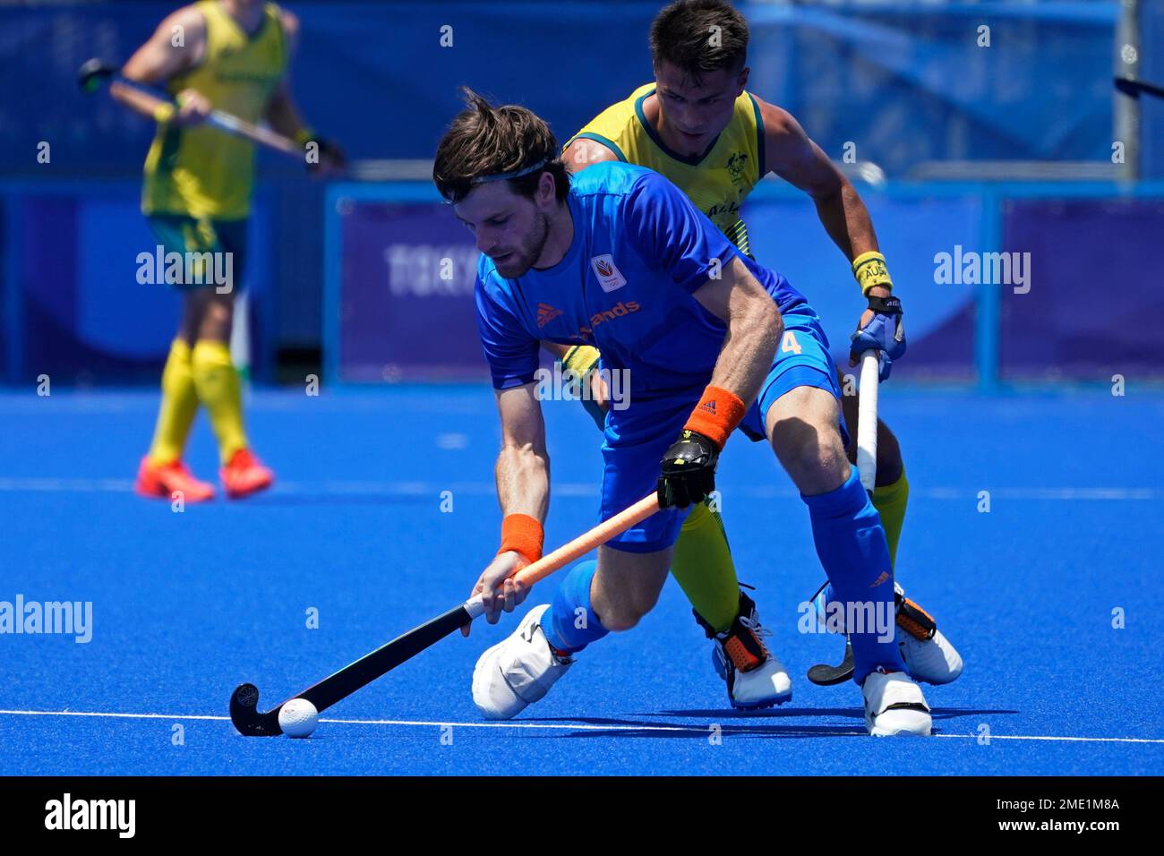 Netherlands' Lars Balk (4) drives around Australia's Tim Brand (29 ...