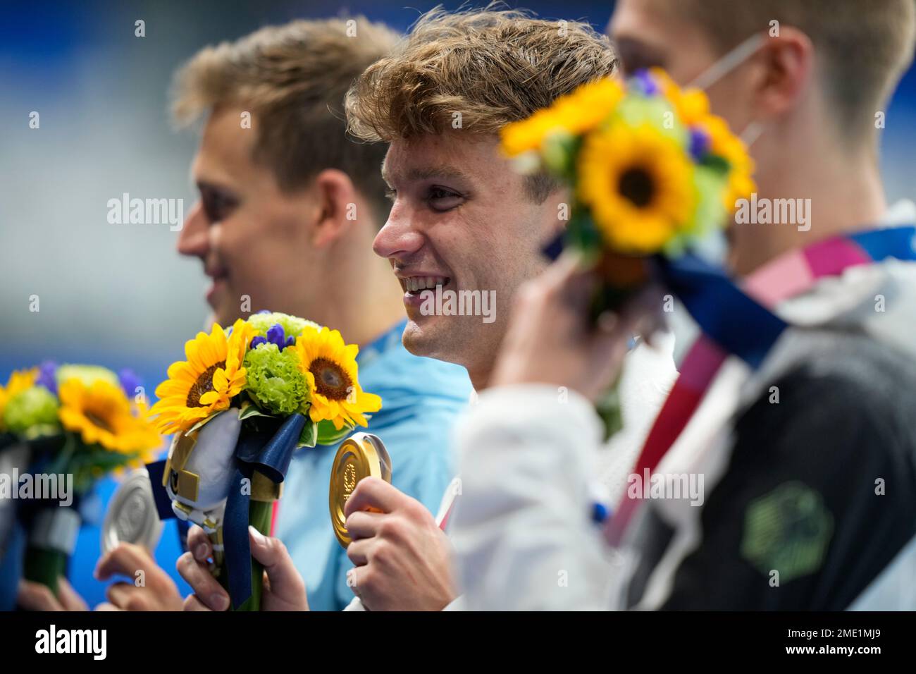 Robert Finke, of United States, poses after winning the gold medal in a ...