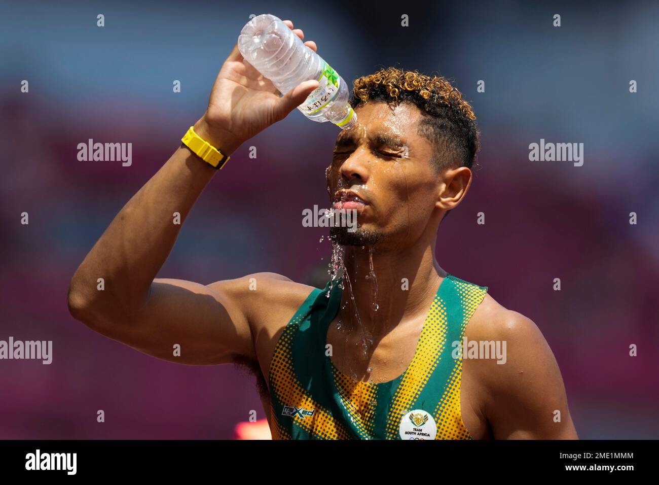 Wayde Van Niekerk, of South Africa, cools off after a heat in the men's ...