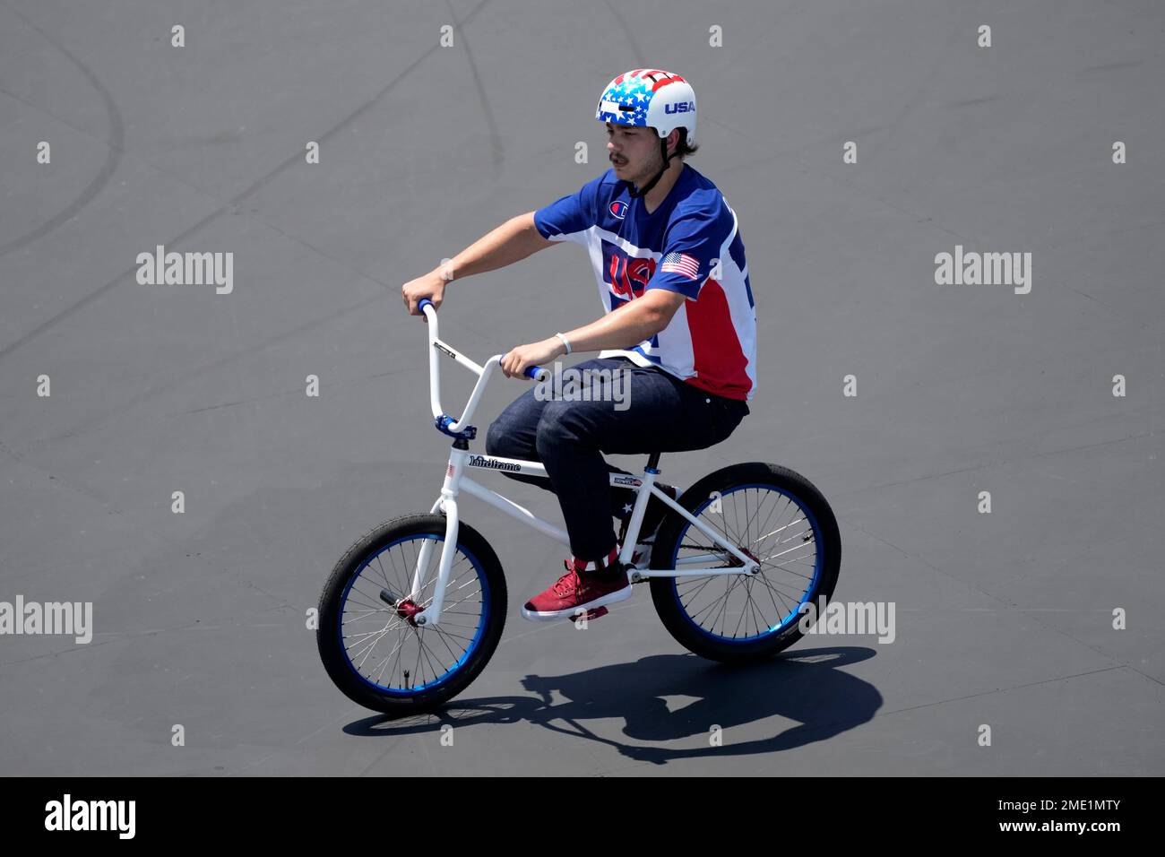 Justin Dowell of the United States rides off after falling in the men's ...