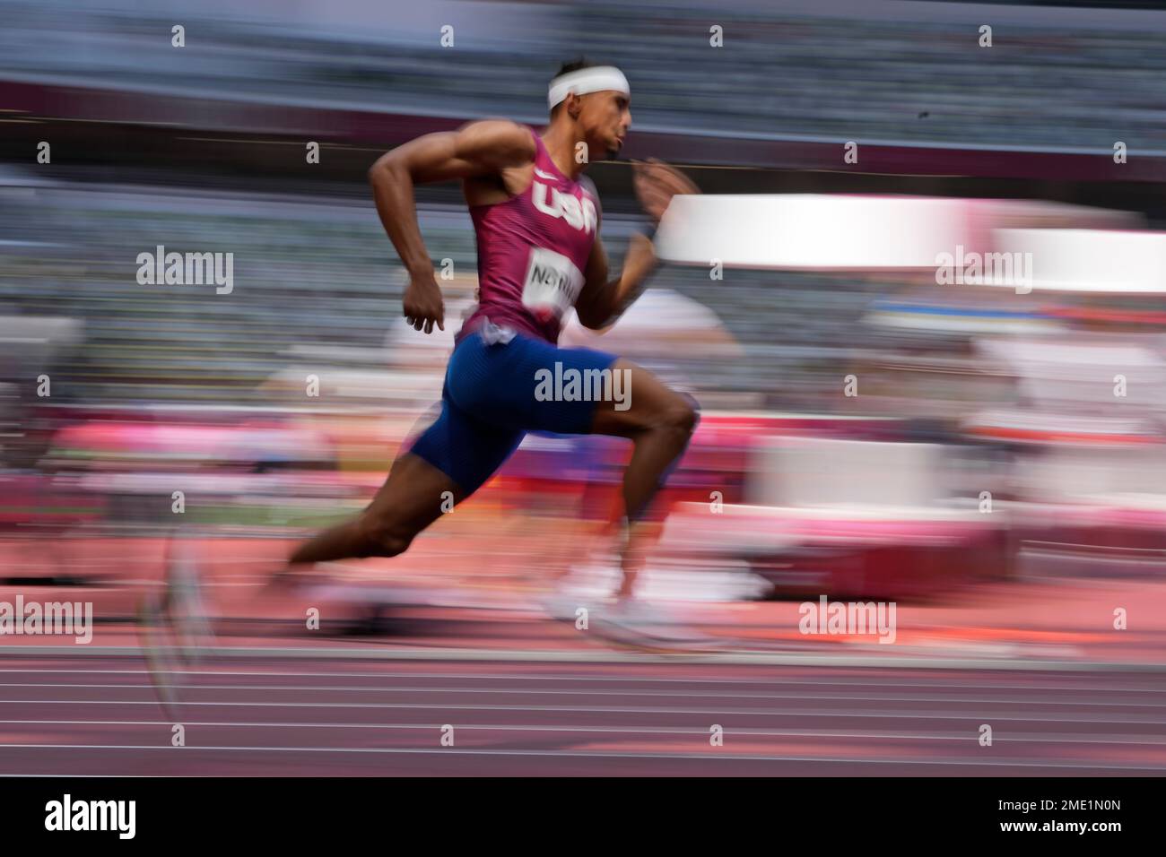 Michael Norman, of the United States, competes in a heat of the men's ...