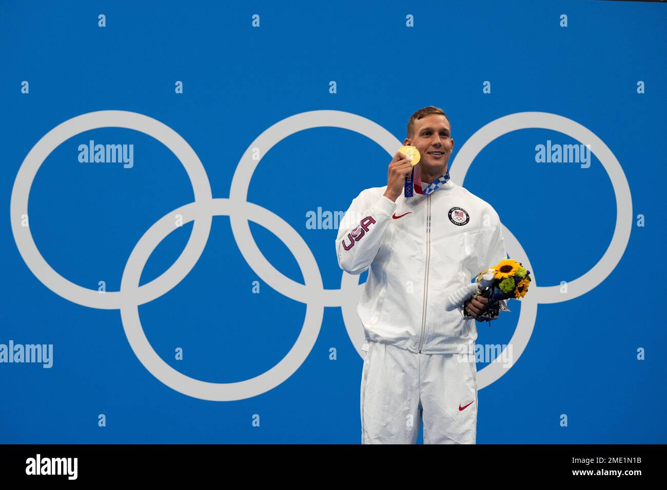 Caeleb Dressel, of United States, poses after winning the gold medal in ...
