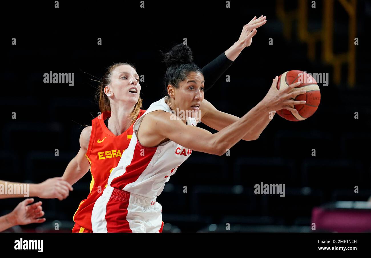 Canada's Miranda Ayim (9), right, passes the ball ahead of Spain's ...
