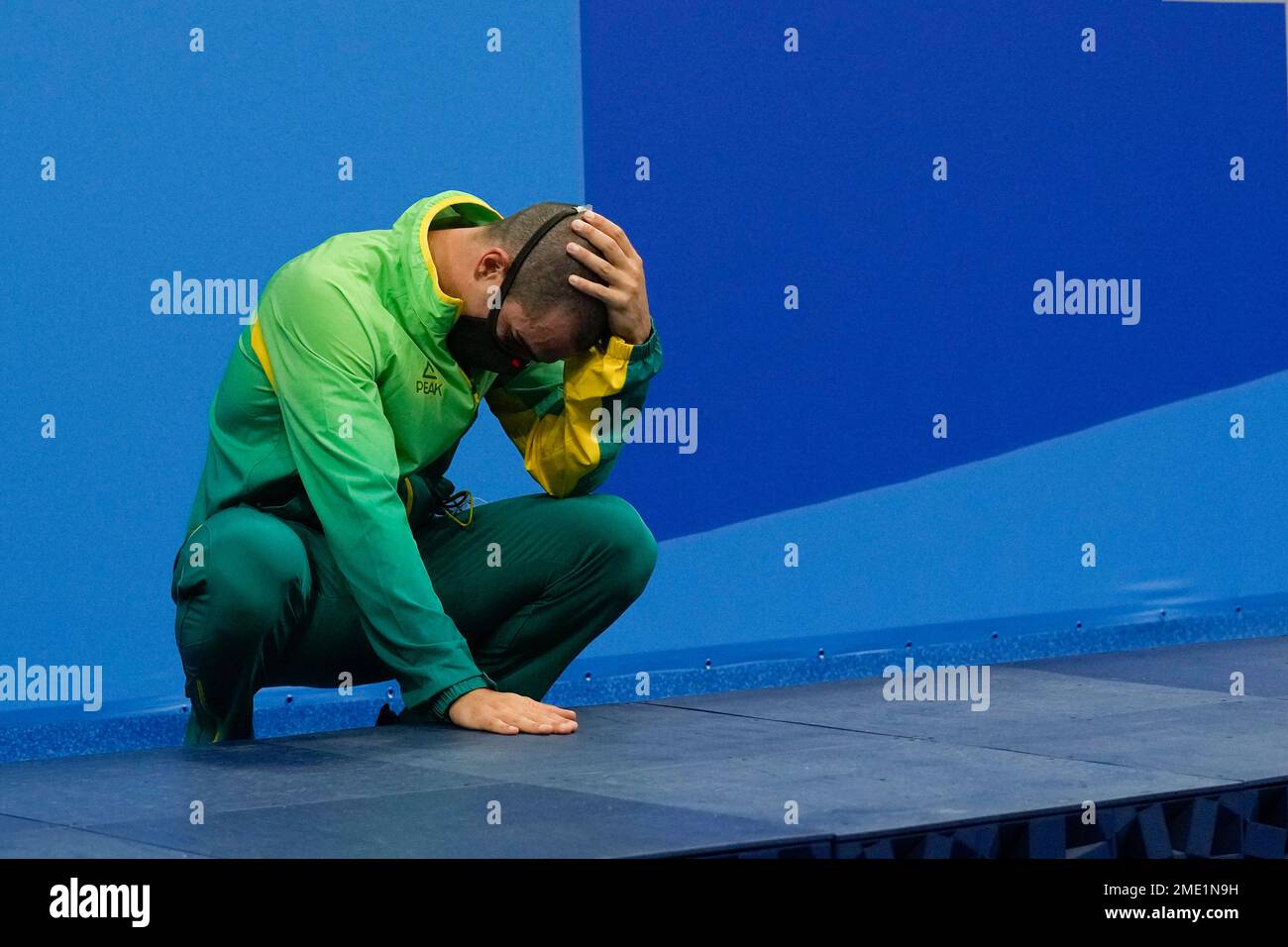 Bruno Fratus, of Brazil, celebrates at the podium after winning the ...