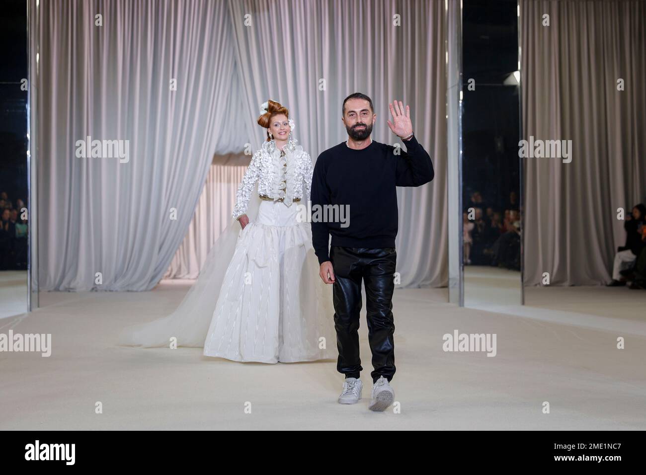 Designer Giambattista Valli accepts applause at the end of the ...