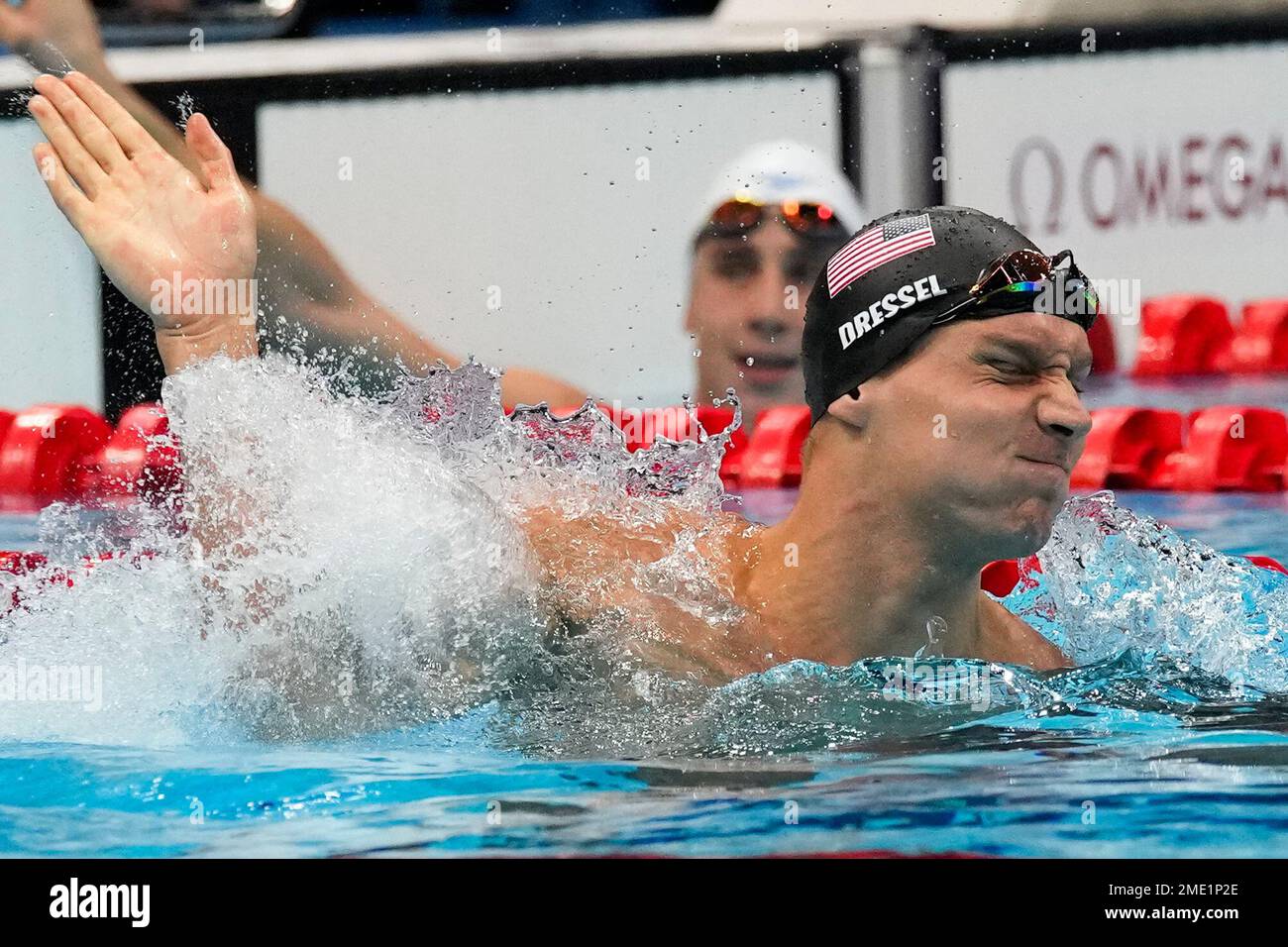 Caeleb Dressel, of United States, celebrates after winning the gold ...