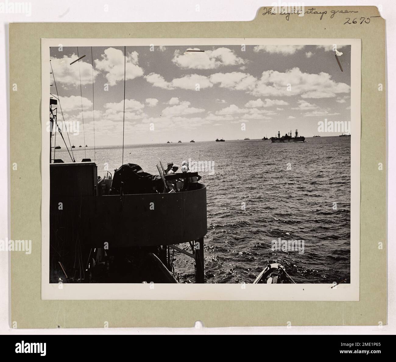This image shows a long procession of merchant ships under the ...