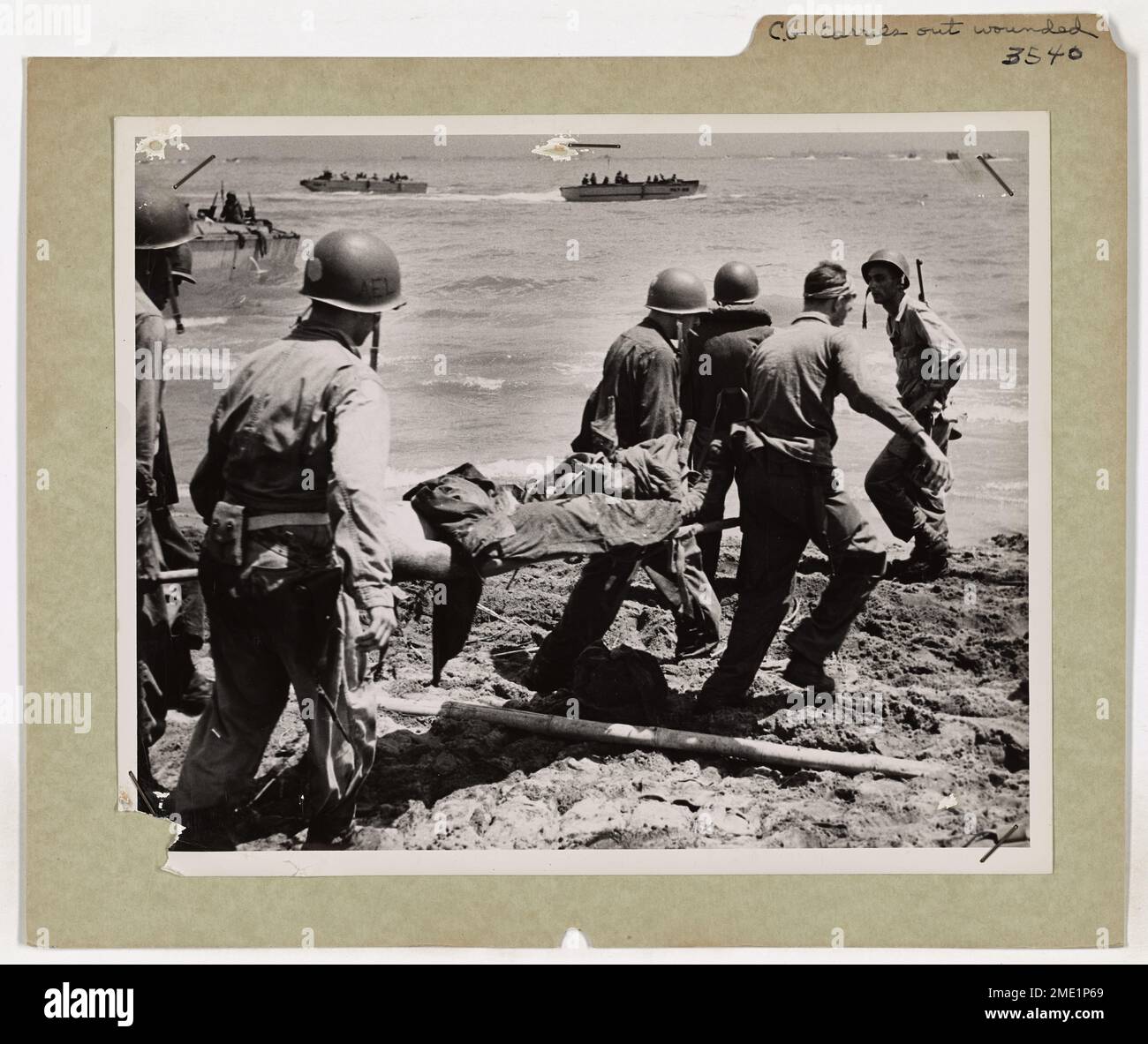 Coast Guardsmen evacuate a wounded Army soldier from Leyte Island ...