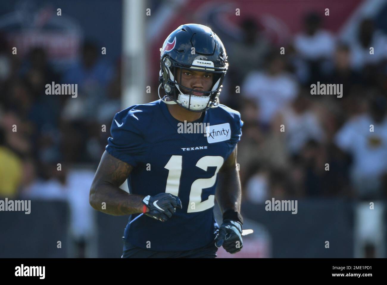 Texans wide receiver Nico Collins (12) works out with the team during ...