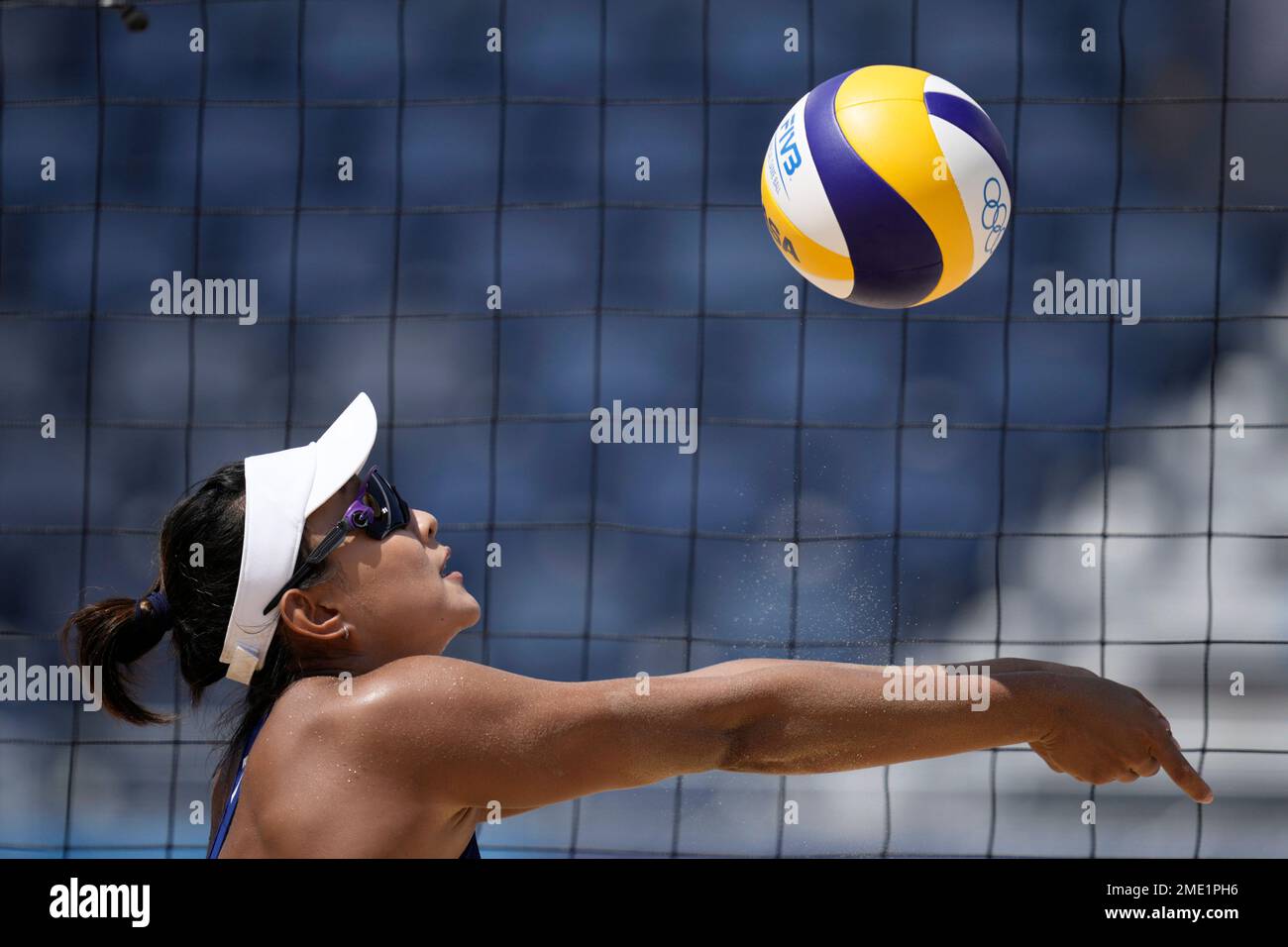 Xia Xinyi, of China, competes during a women's beach volleyball match ...