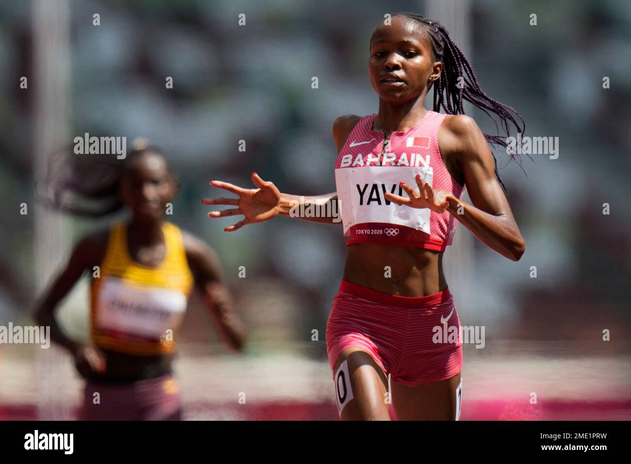 Winfred Yavi, of Bahrain, wins a heat of the women's 3,000-meter ...