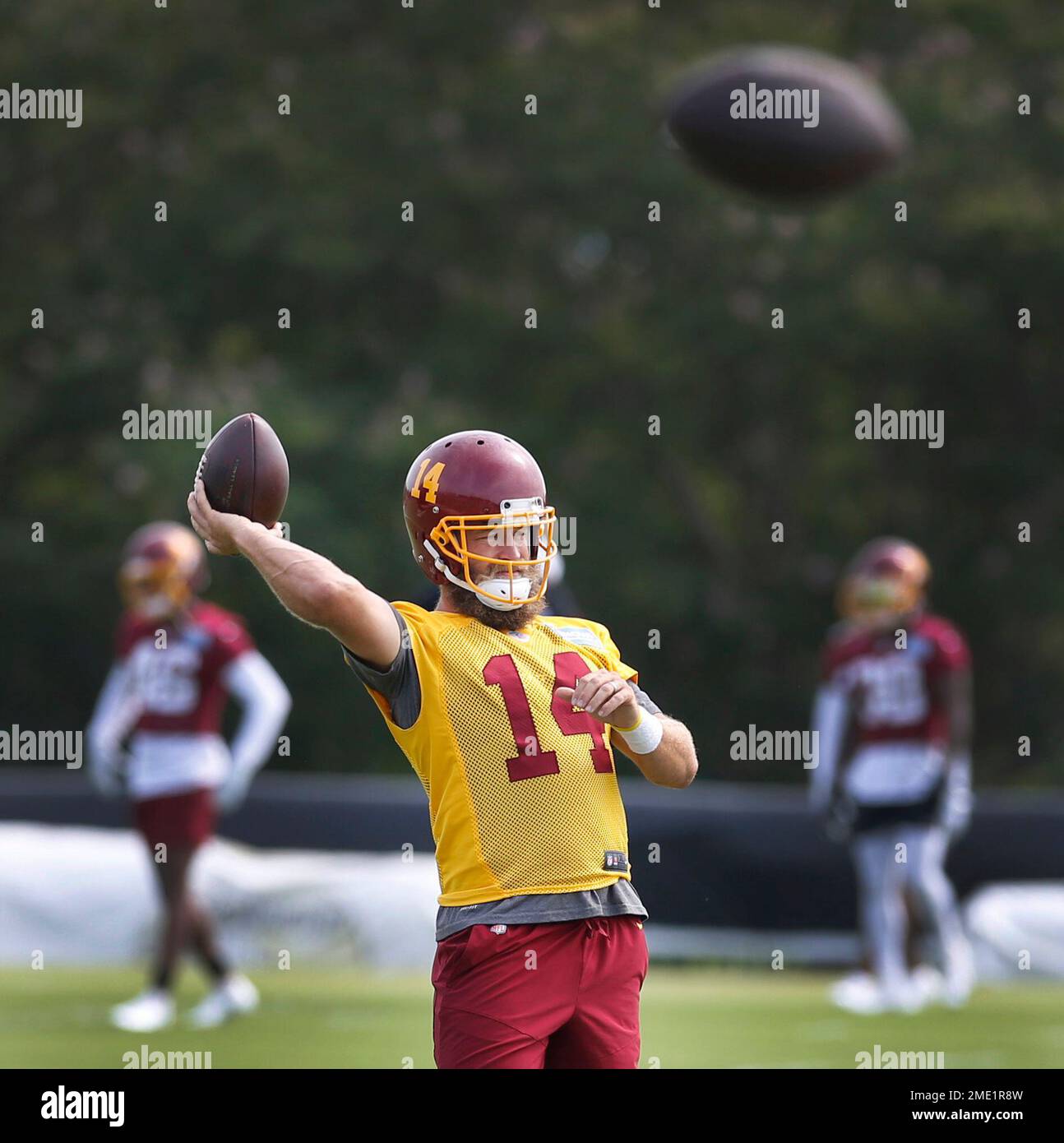 Washington Football Team's uarterback Ryan Fitzpatrick warms up before ...
