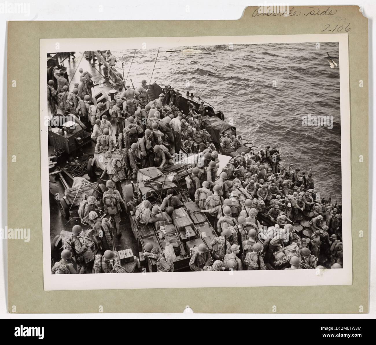 Marines and their equipment disembark from a Coast Guard-manned assault ...