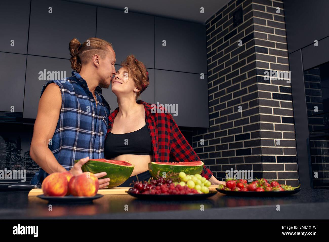 Couple fooling around in kitchen hi-res stock photography and images ...