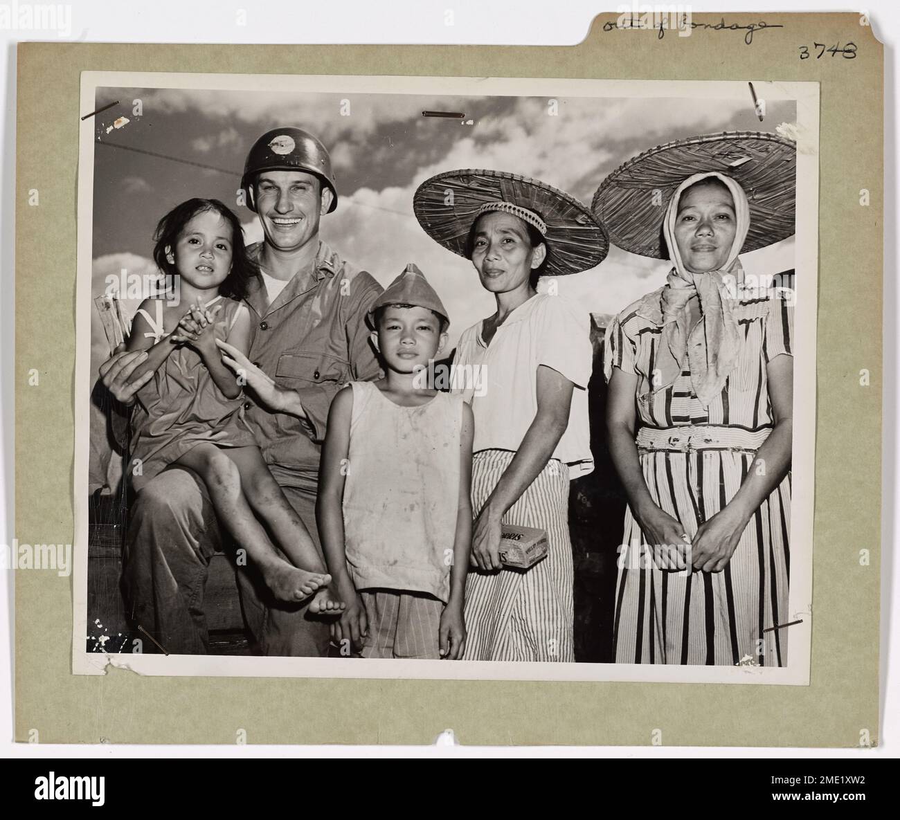 A Filipino family, liberated from Japanese occupation on Leyte Island ...
