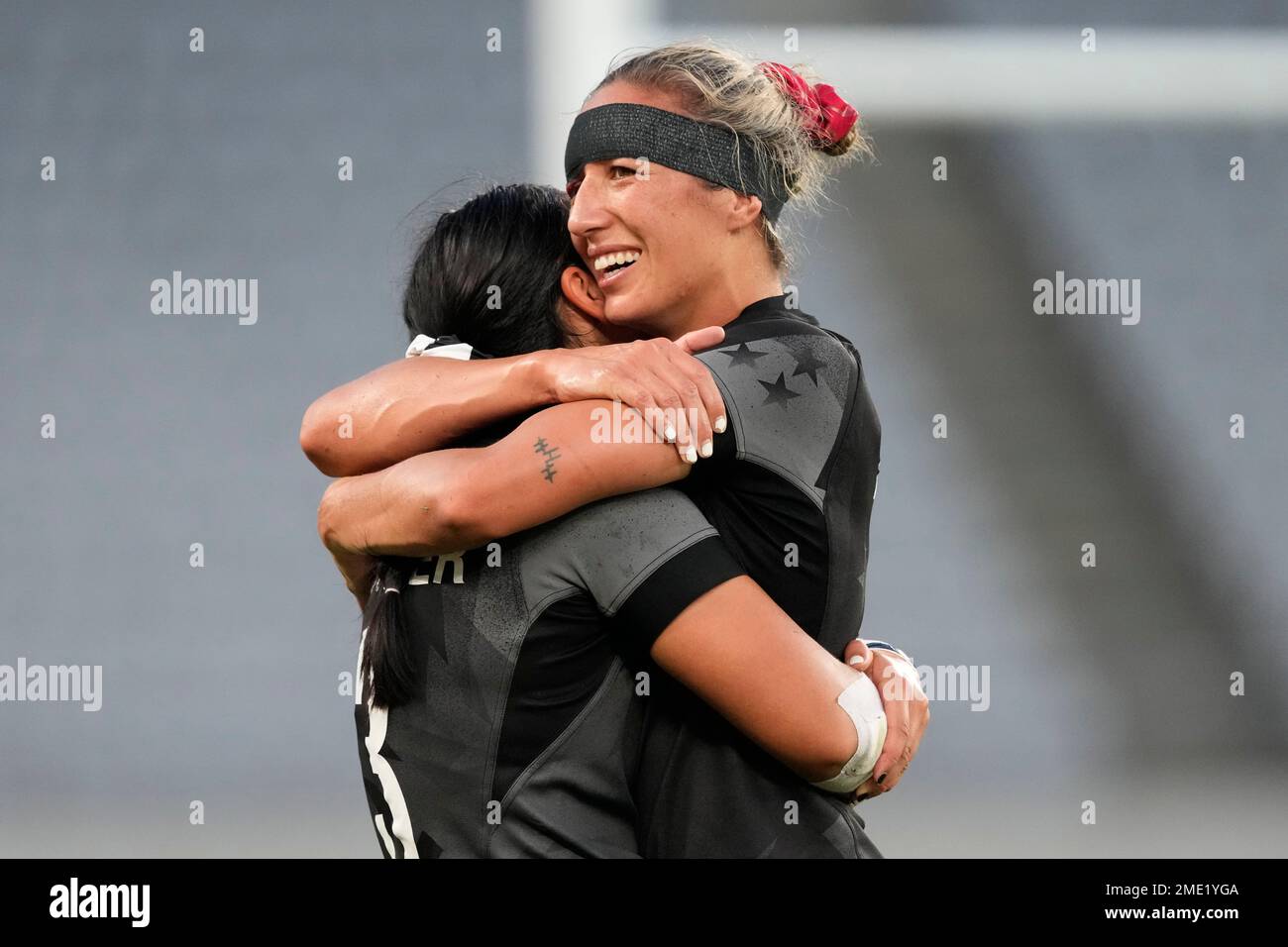 New Zealand's captain Sarah Hirini, right, hugs teammate Stacey Fluhler ...
