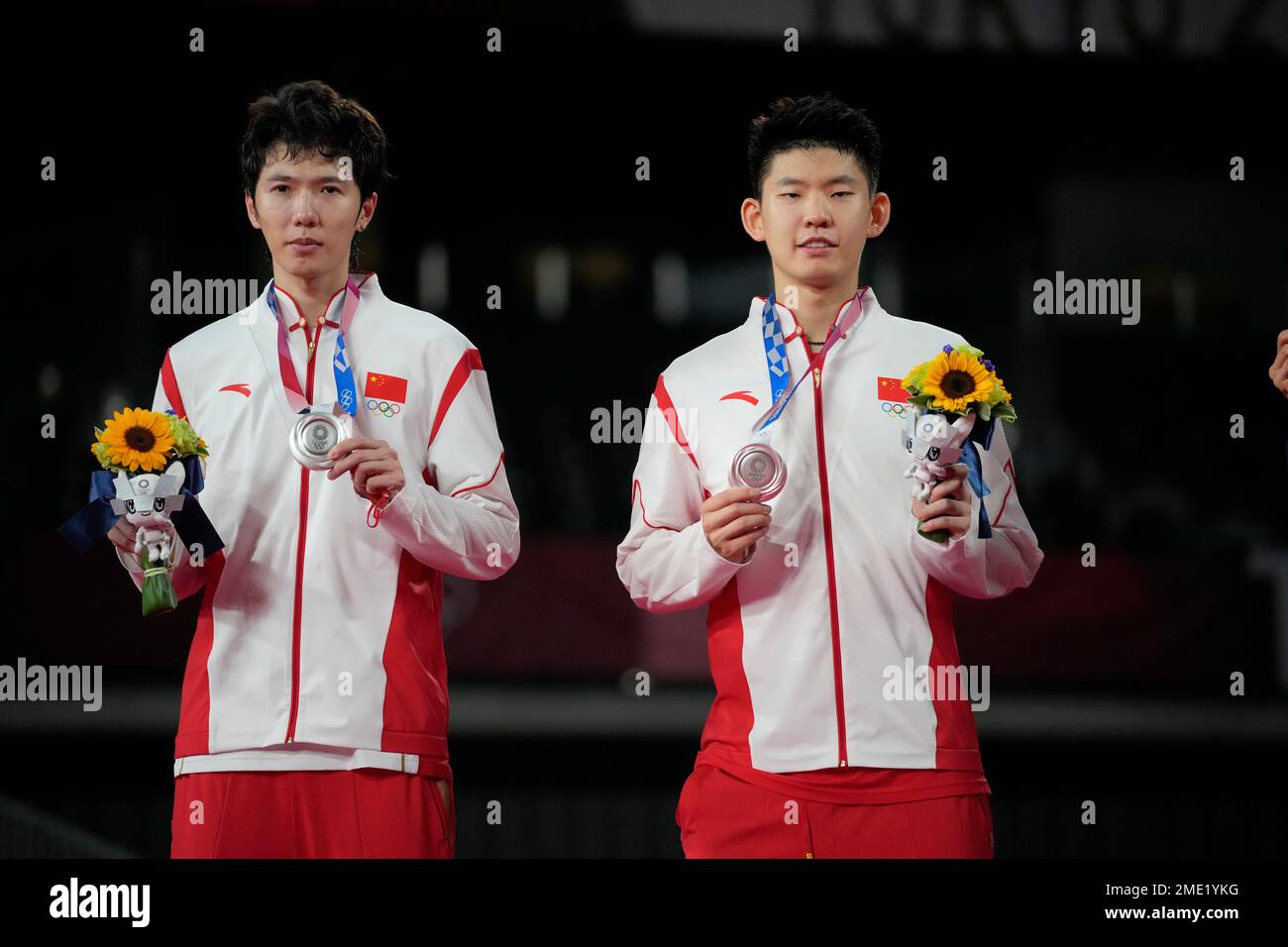 Silver medalists Li Jun Hui and Liu Yu Chen of China celebrate during ...