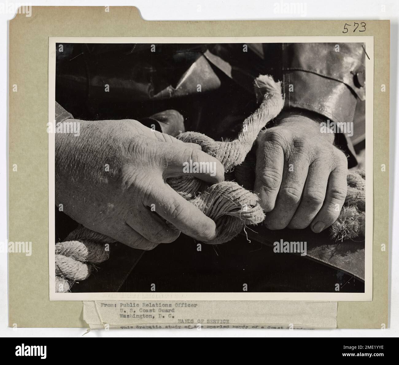 A dramatic image of a Coast Guardsman’s gnarled hands, symbolizing ...