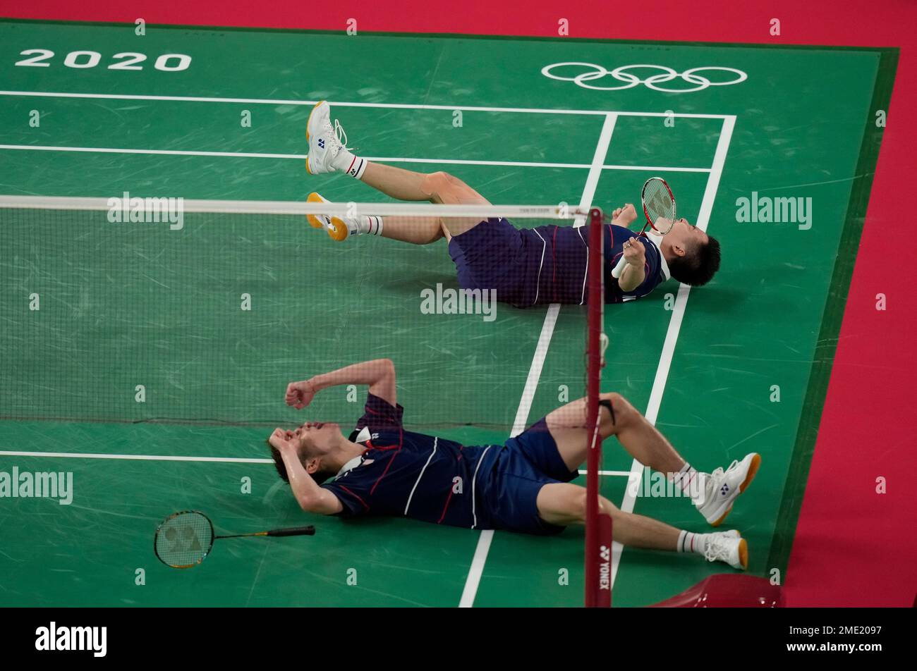 Malaysia's Malaysia's Aaron Chia and Soh Wooi Yik celebrate after winning against Indonesia's ...