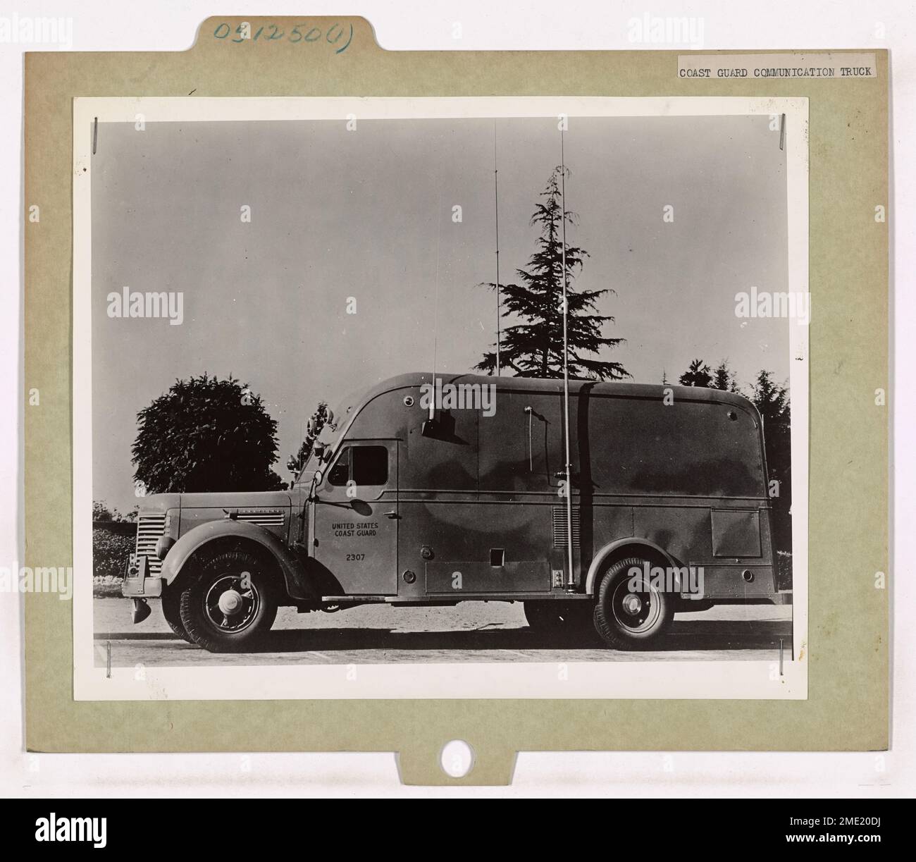 The image shows the exterior of a Coast Guard communication truck, a ...