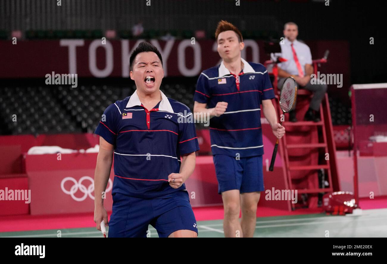 Malaysia's Malaysia's Aaron Chia, left, and Soh Wooi Yik celebrate after winning against ...
