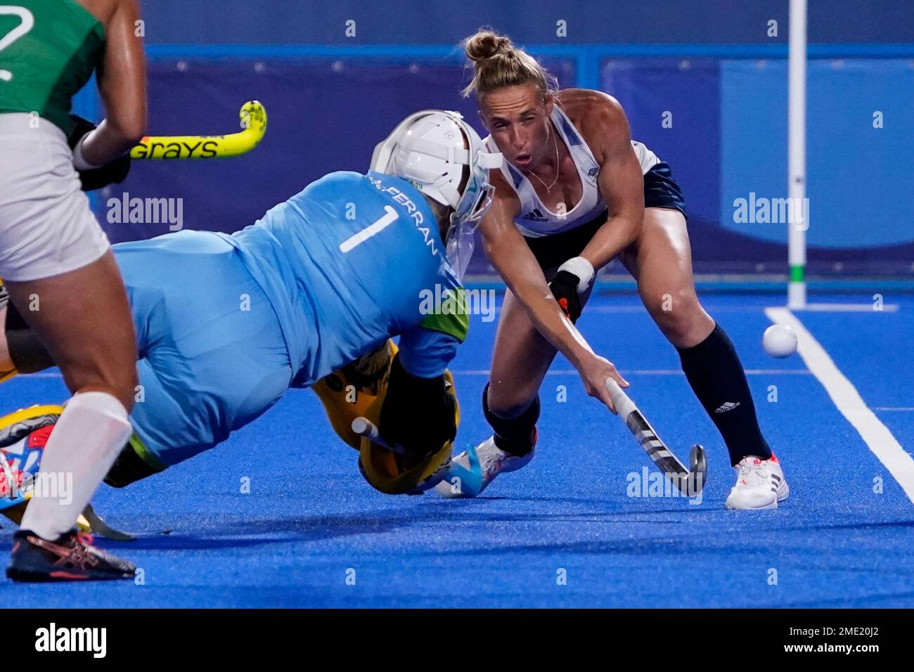 Britain's Susannah Townsend, right, scores on Ireland goalkeeper ...