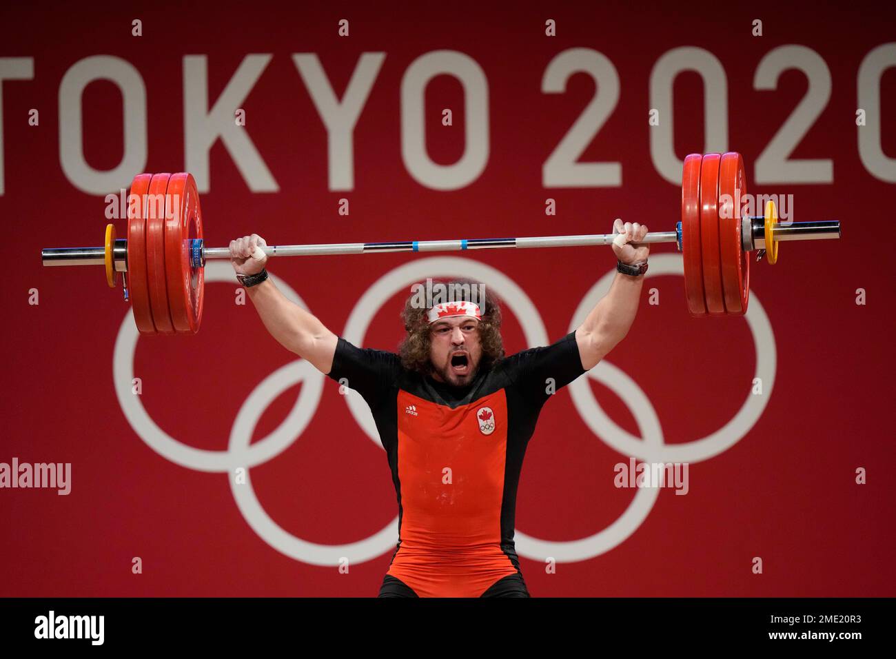 Boady Robert Santavy of Canada competes in the men's 96g weightlifting ...