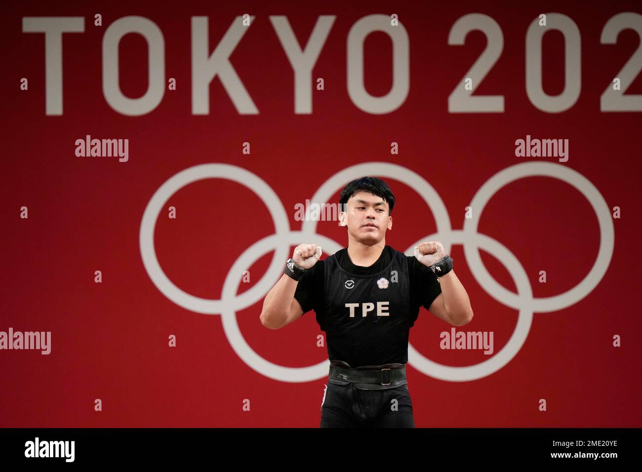 Po-Jen Chen of Taiwan celebrates after a lift as he competes in the men ...