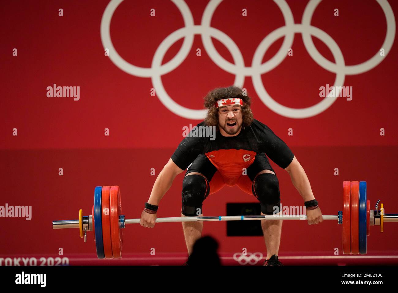 Boady Robert Santavy of Canada competes in the men's 96kg weightlifting ...