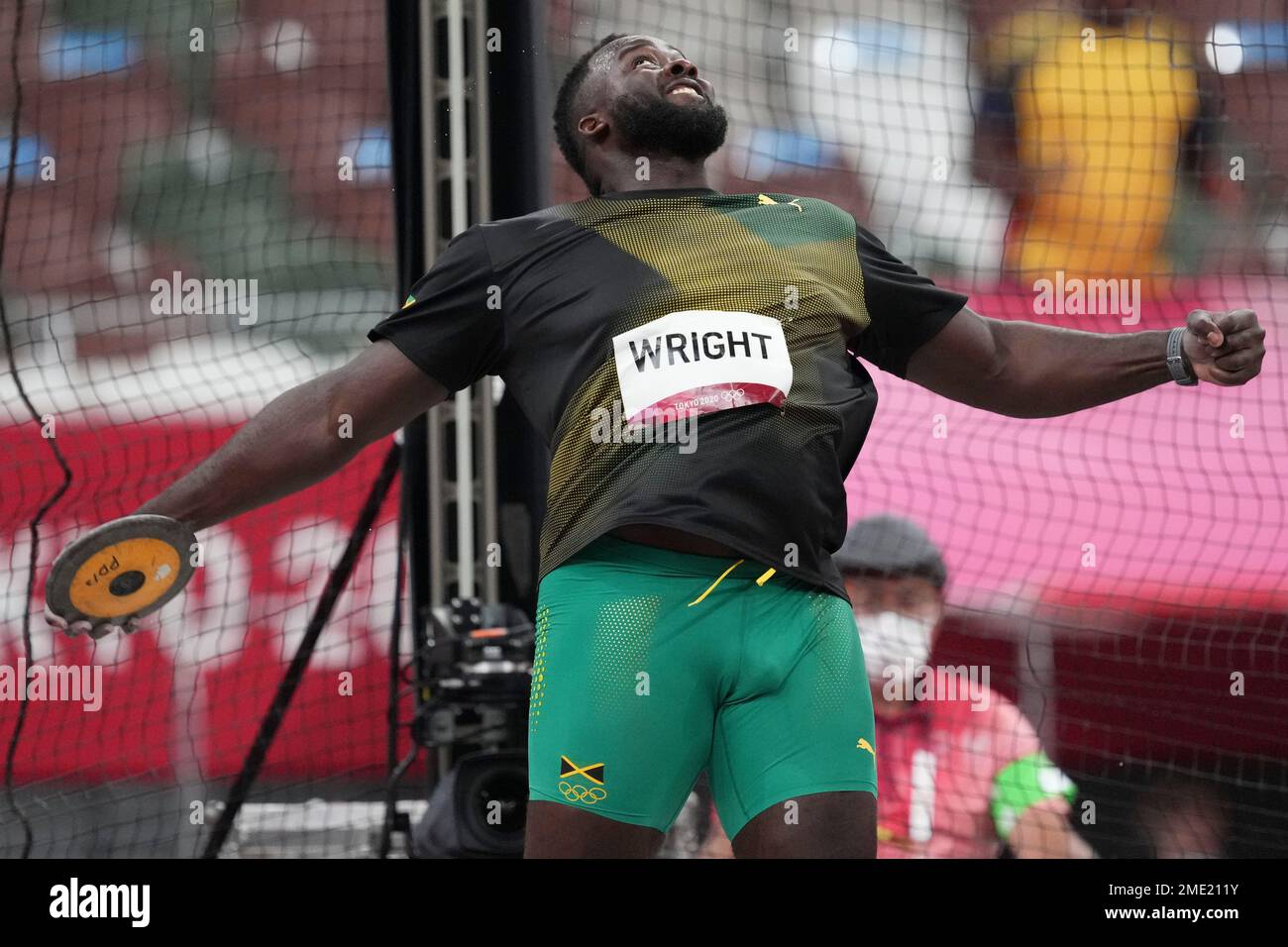 Chad Wright, of Jamaica, competes in the final of the men's discus ...