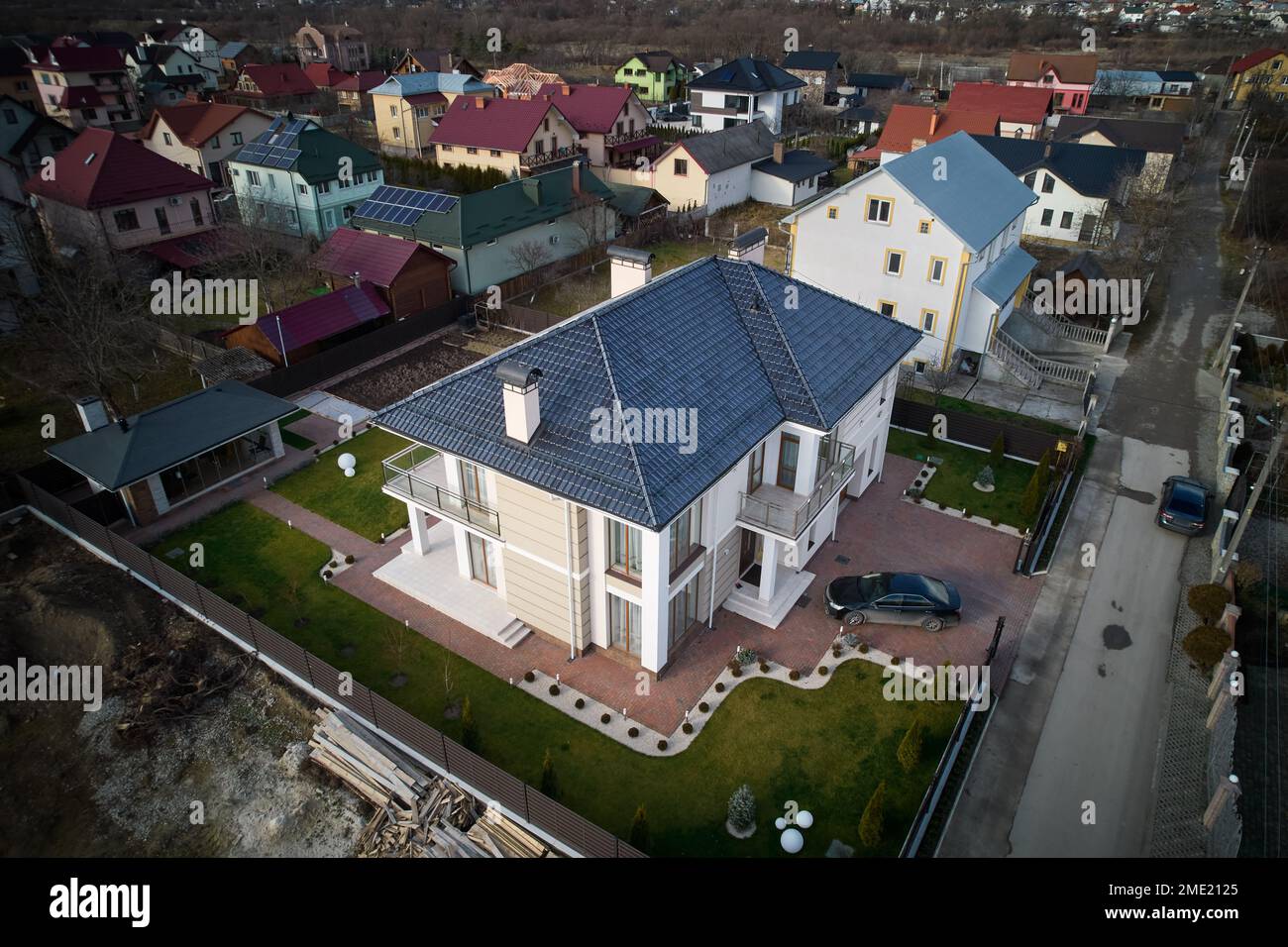 Aerial drone view of residential house with photovoltaic solar panels ...