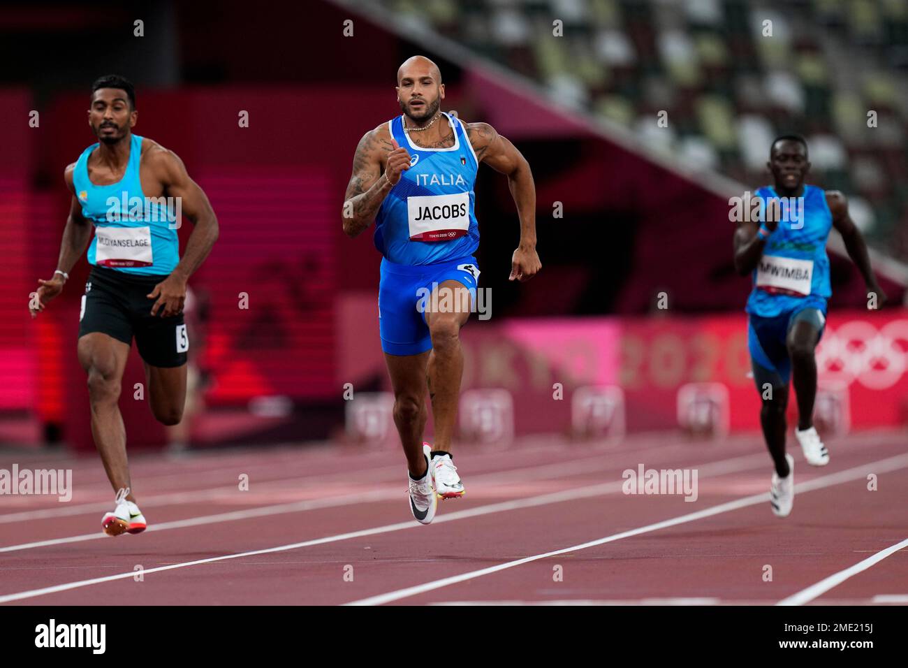 Lamont Jacobs, of Italy, wins a heat in the men's 100-meter run at the ...
