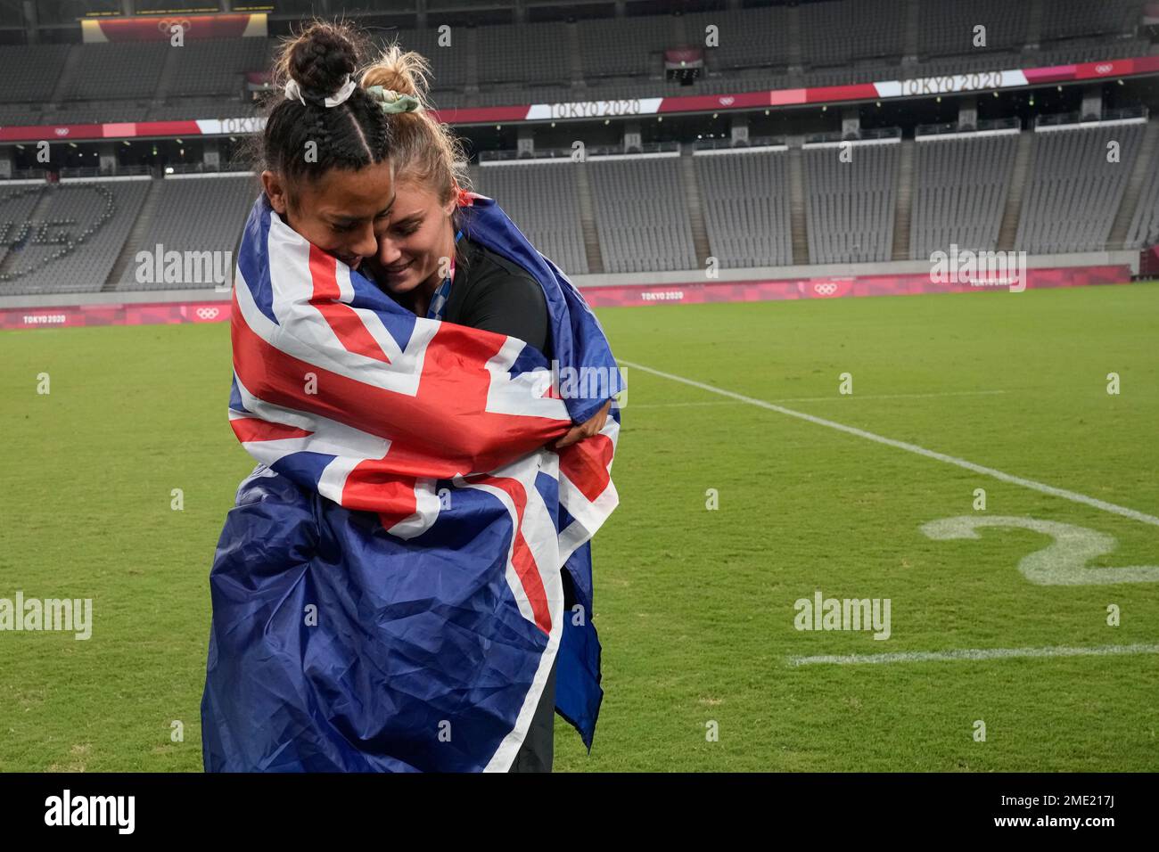 New Zealand's Risi Pouri-Lane, left, and Michaela Blyde hug, wrapped in ...
