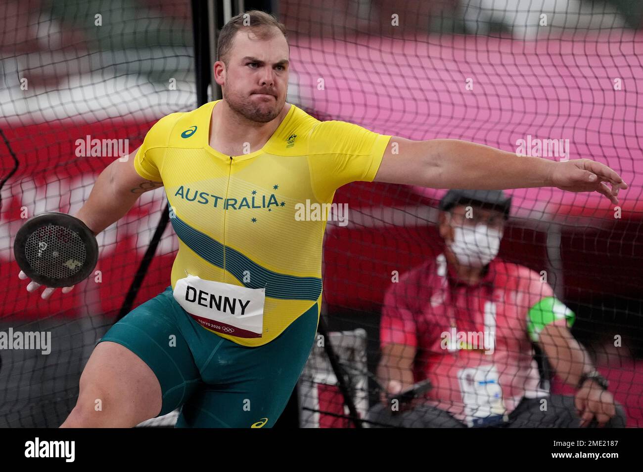 Matthew Denny, of Australia, competes in the final of the men's discus ...