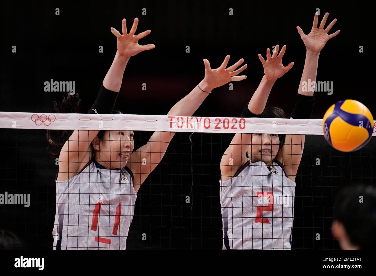 Japan's Erika Shinomiya, left, and Sarina Koga, block a ball during a ...