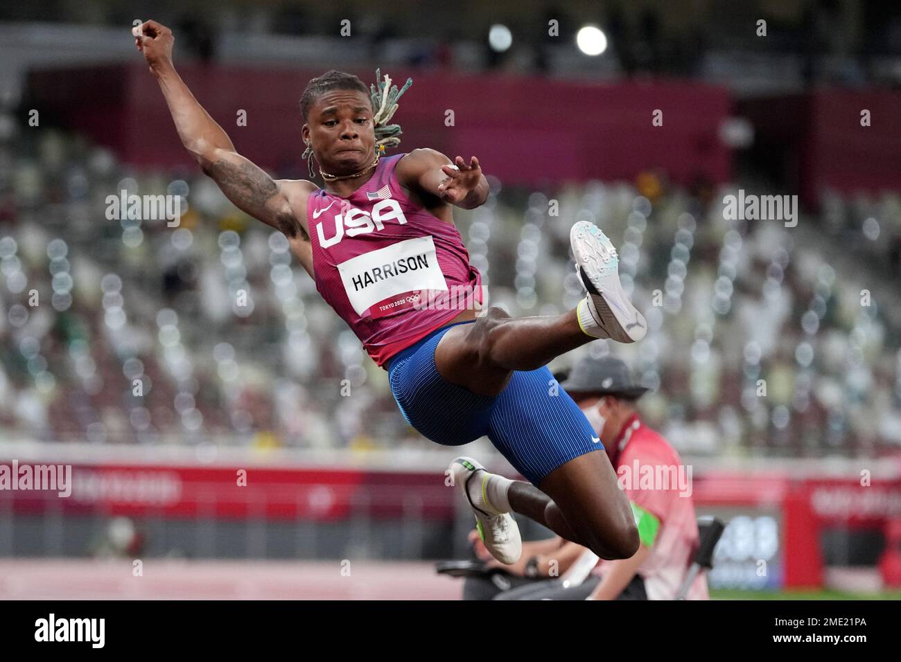 Juvaughn Harrison, of United States, competes in the qualification ...