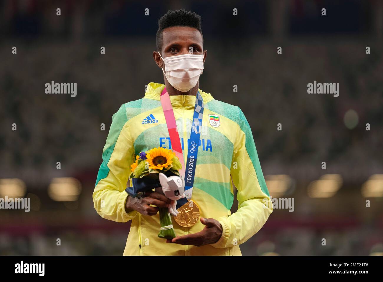 Selemon Barega, of Ethiopia reacts after receiving his gold medal for ...