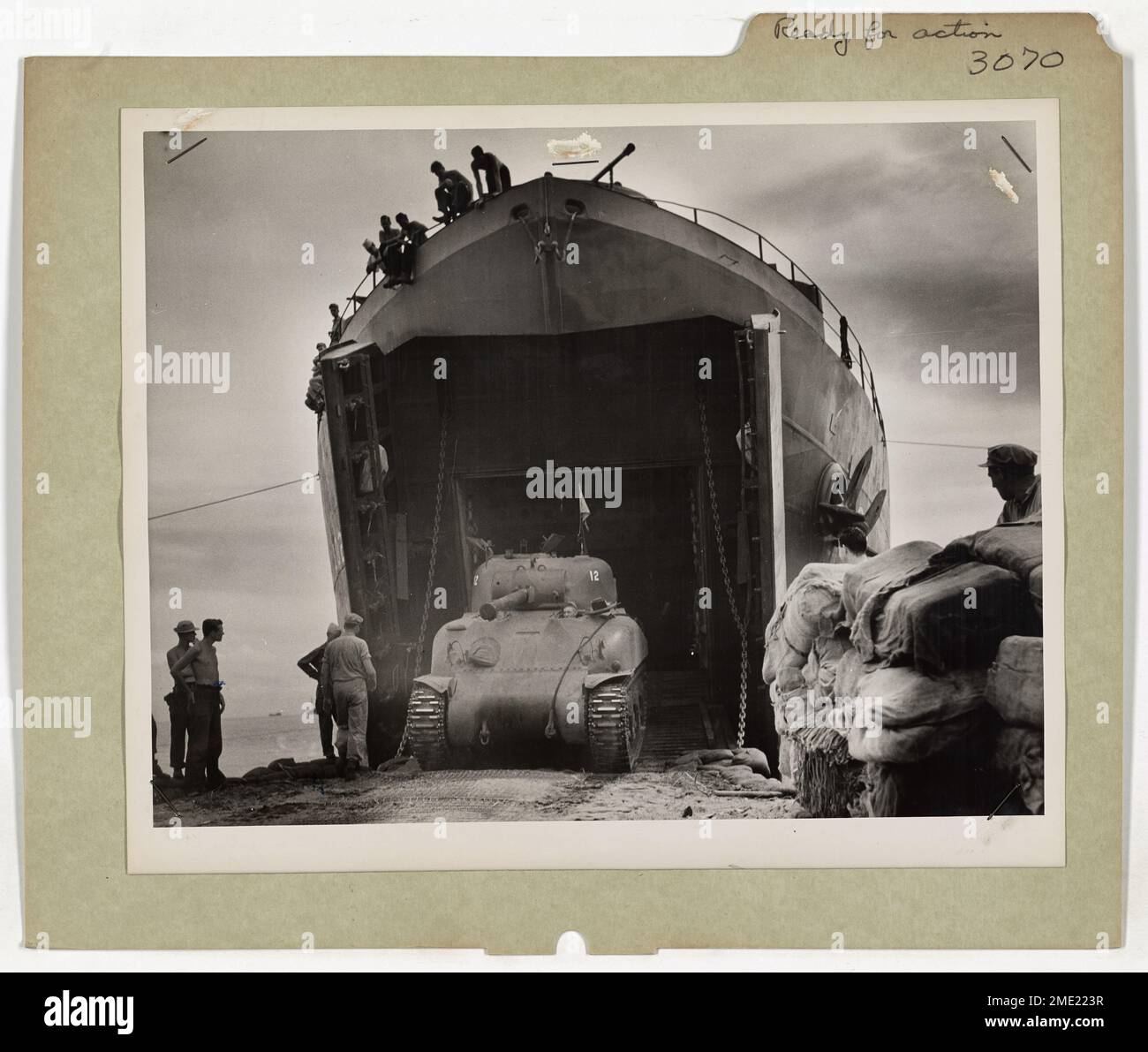 A U.S. tank prepares to roll out of a Coast Guard-manned Landing Ship ...