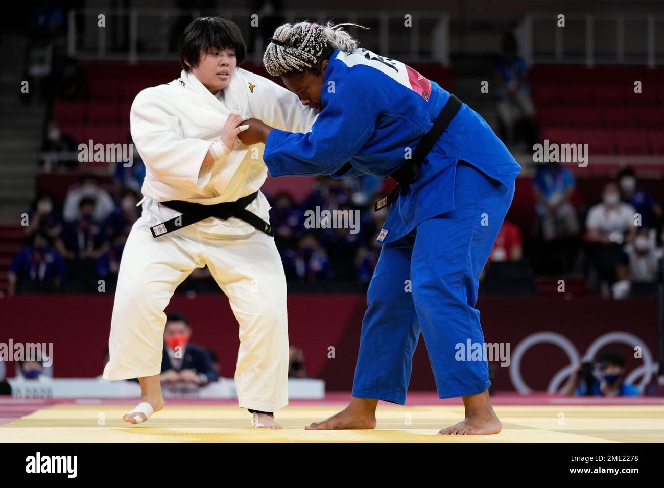 Akira Sone of Japan, left, and Romane Dicko of France compete during ...