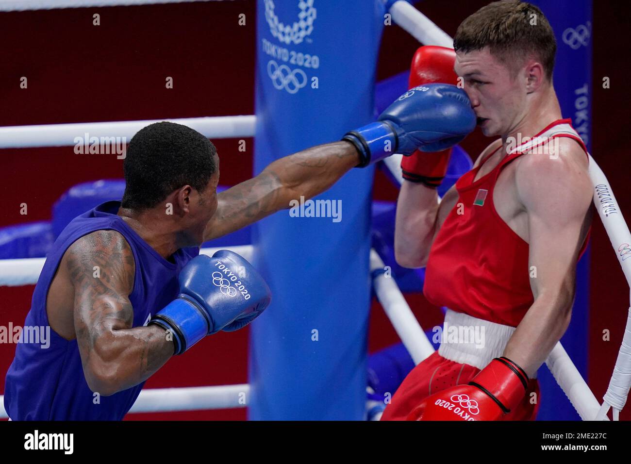 Belarus' Dzmitry Asanau, right is punched by Brazil's Wanderson de ...