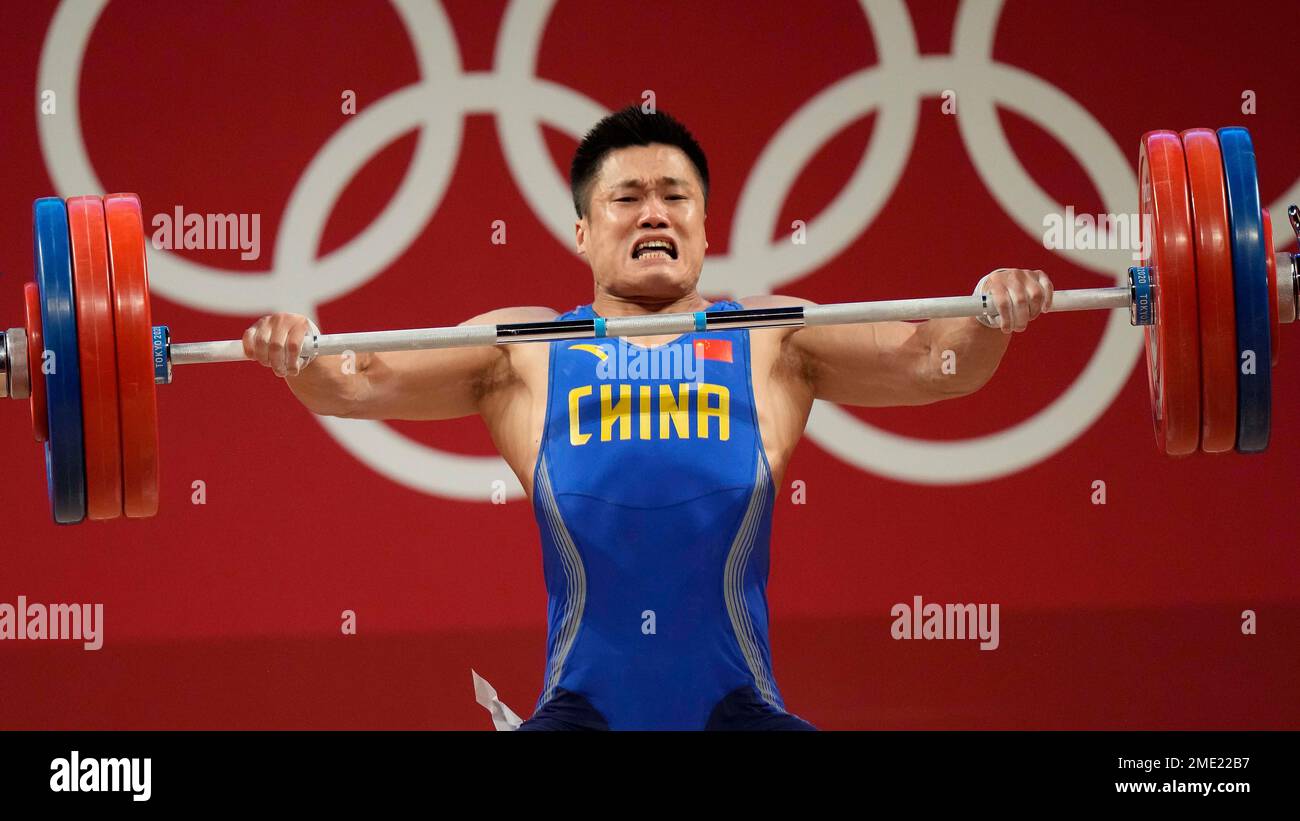 Lyu Xiaojun of China competes in the men's 81kg weightlifting event, at ...