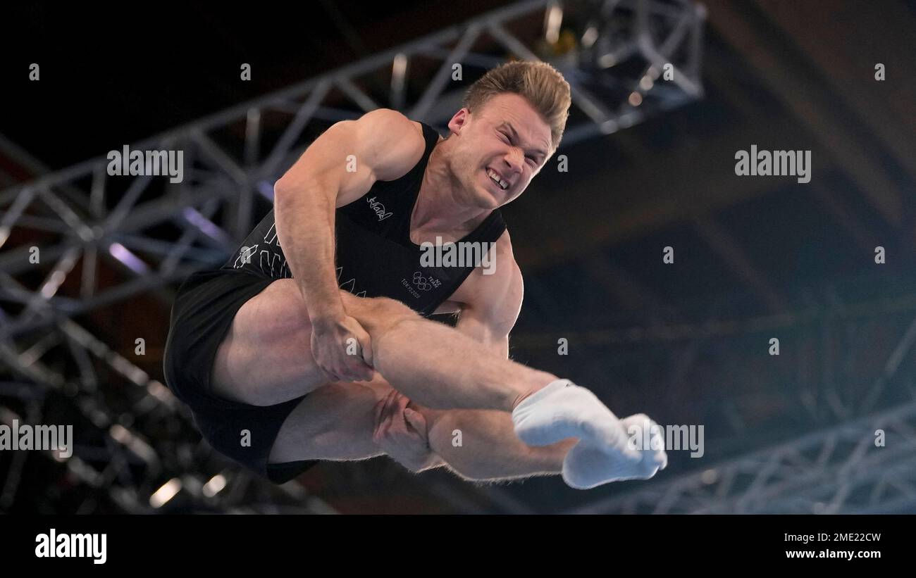 Dylan Schmidt, of New Zealand, performs in the men's trampoline ...