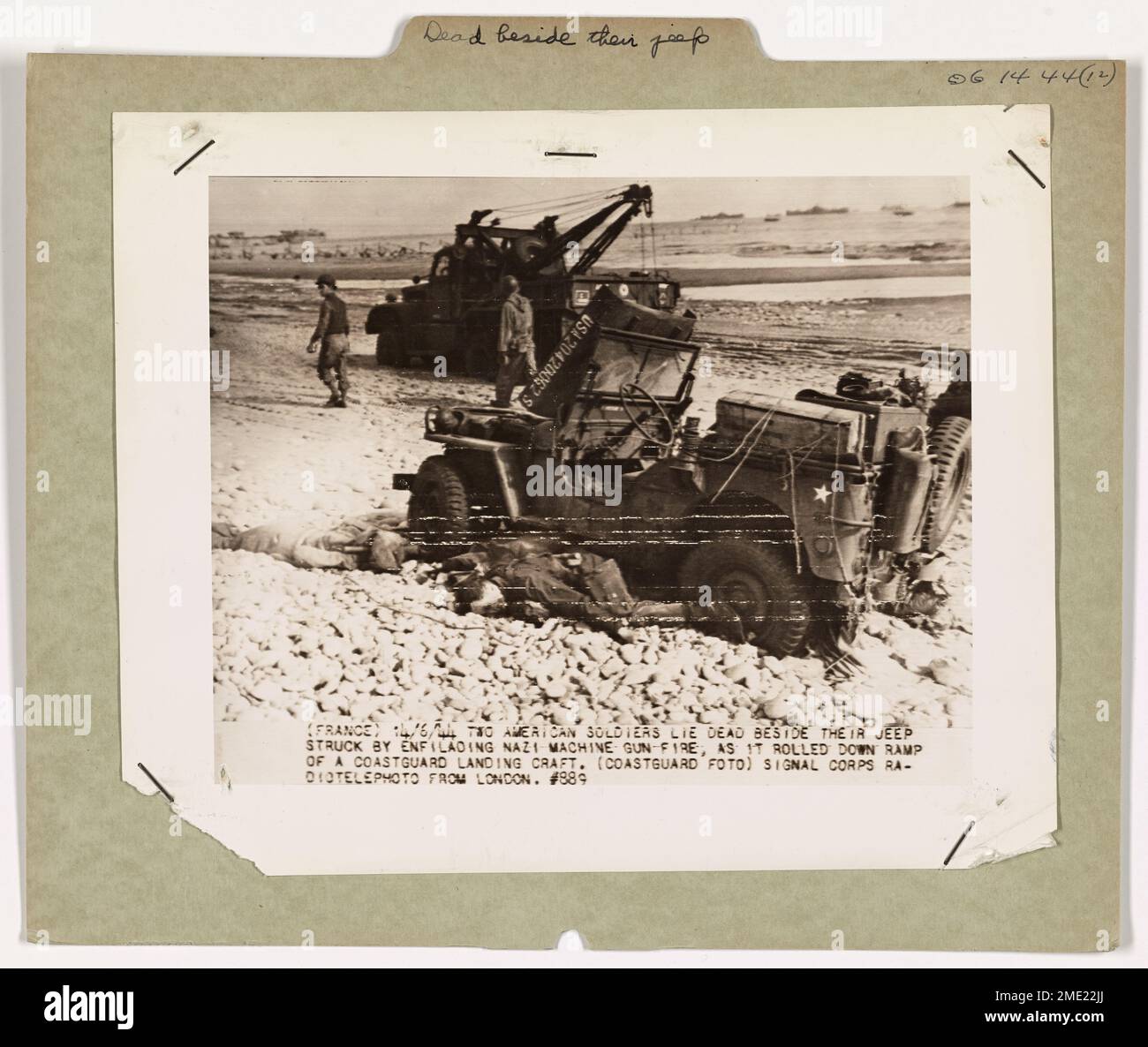Two American soldiers lie dead beside their jeep after being struck by ...