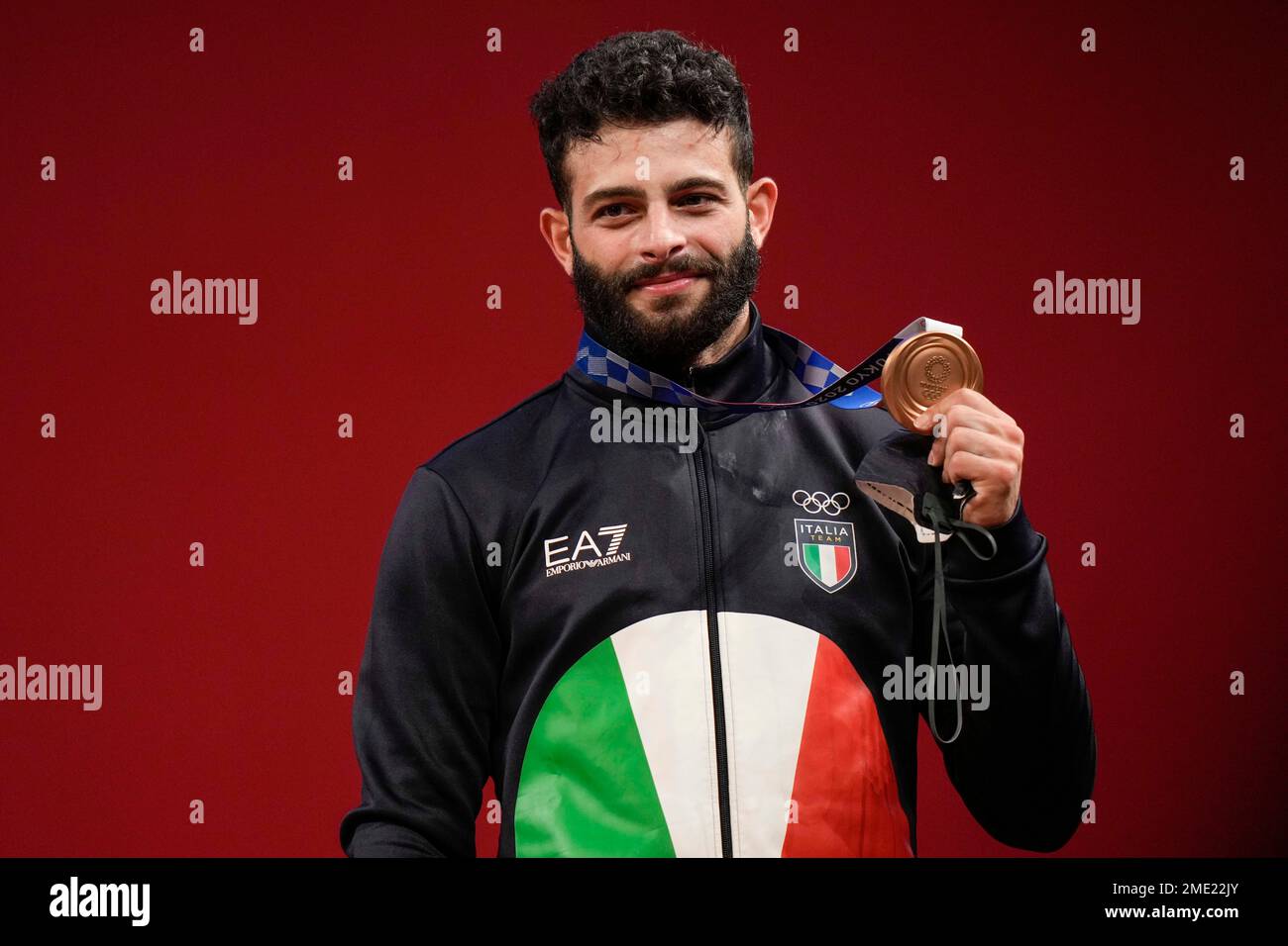 Antonino Pizzolato of Italy celebrates on the podium after winning the ...