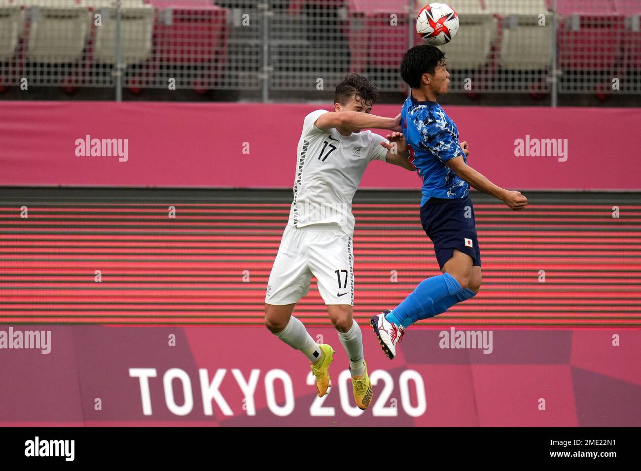 Japan's Reo Hatate, right, and New Zealand's Callan Elliot battle for ...